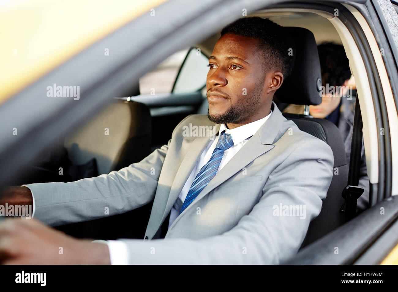 African Businessman Driving Car Stock Photo - Alamy