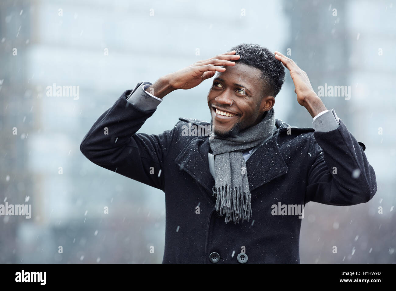Smiling African Man Enjoying Snow Stock Photo - Alamy