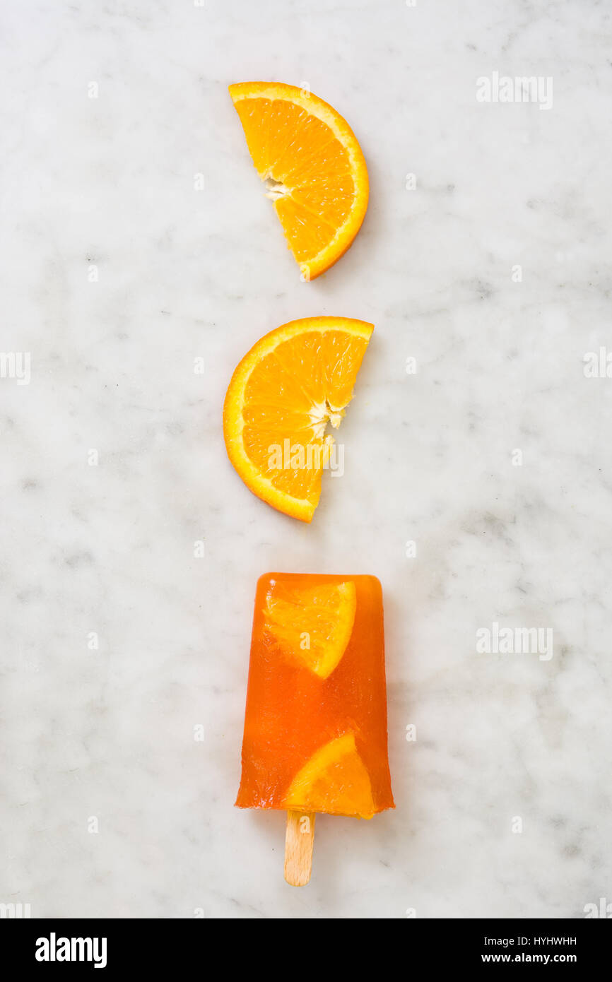 Homemade orange popsicle on marble Stock Photo - Alamy