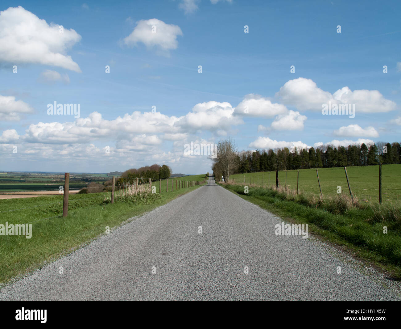 Single lane country road through countryside and farmland Stock Photo ...