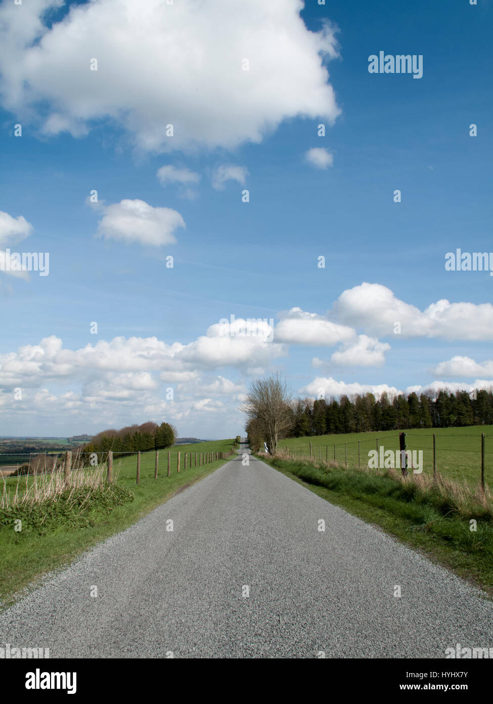 Single lane country road through countryside and farmland Stock Photo ...