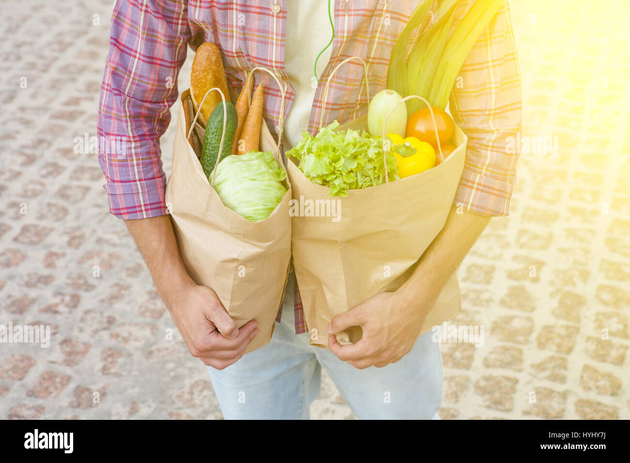 Young man with products Stock Photo - Alamy