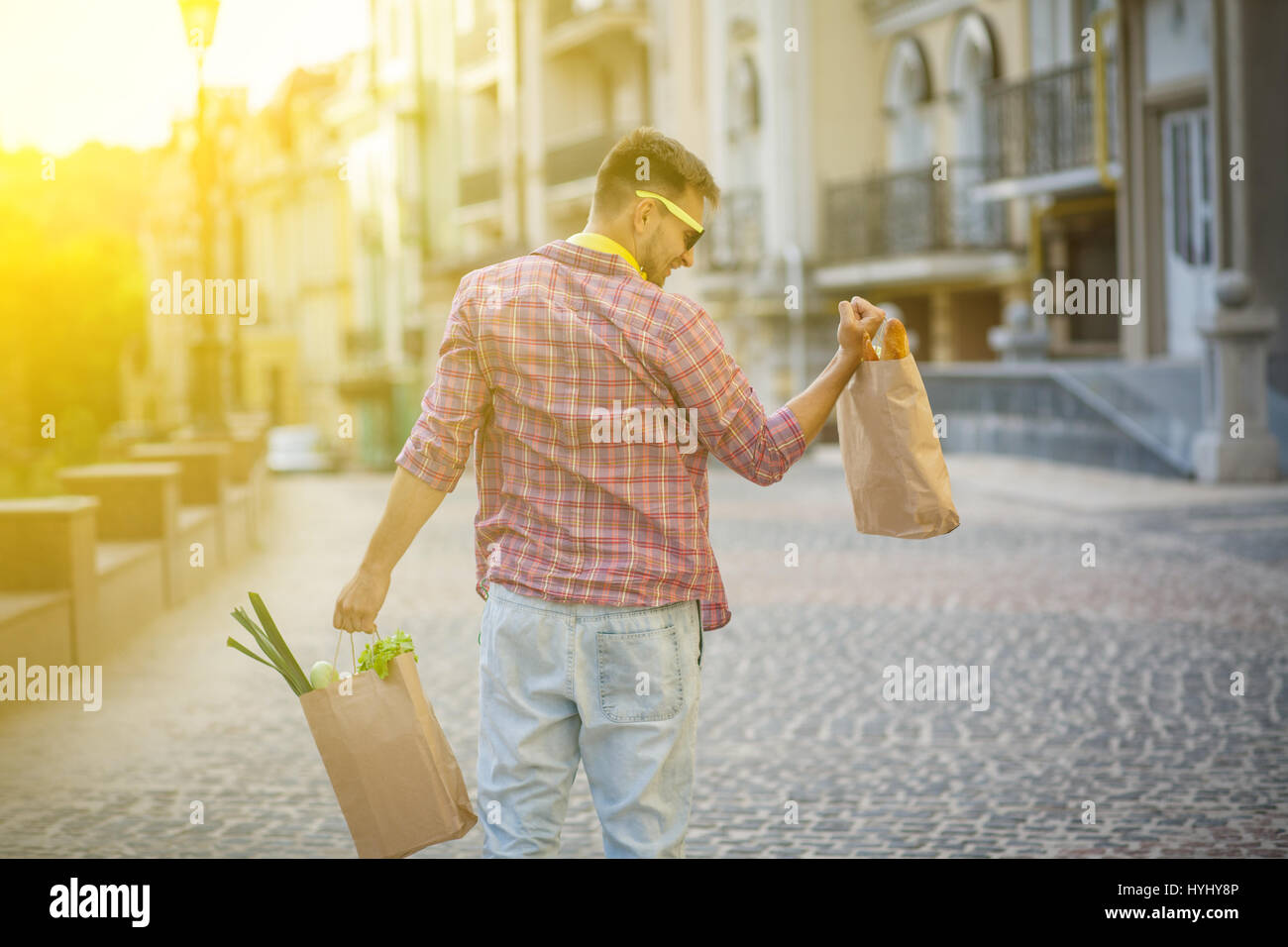 Young man with products Stock Photo - Alamy