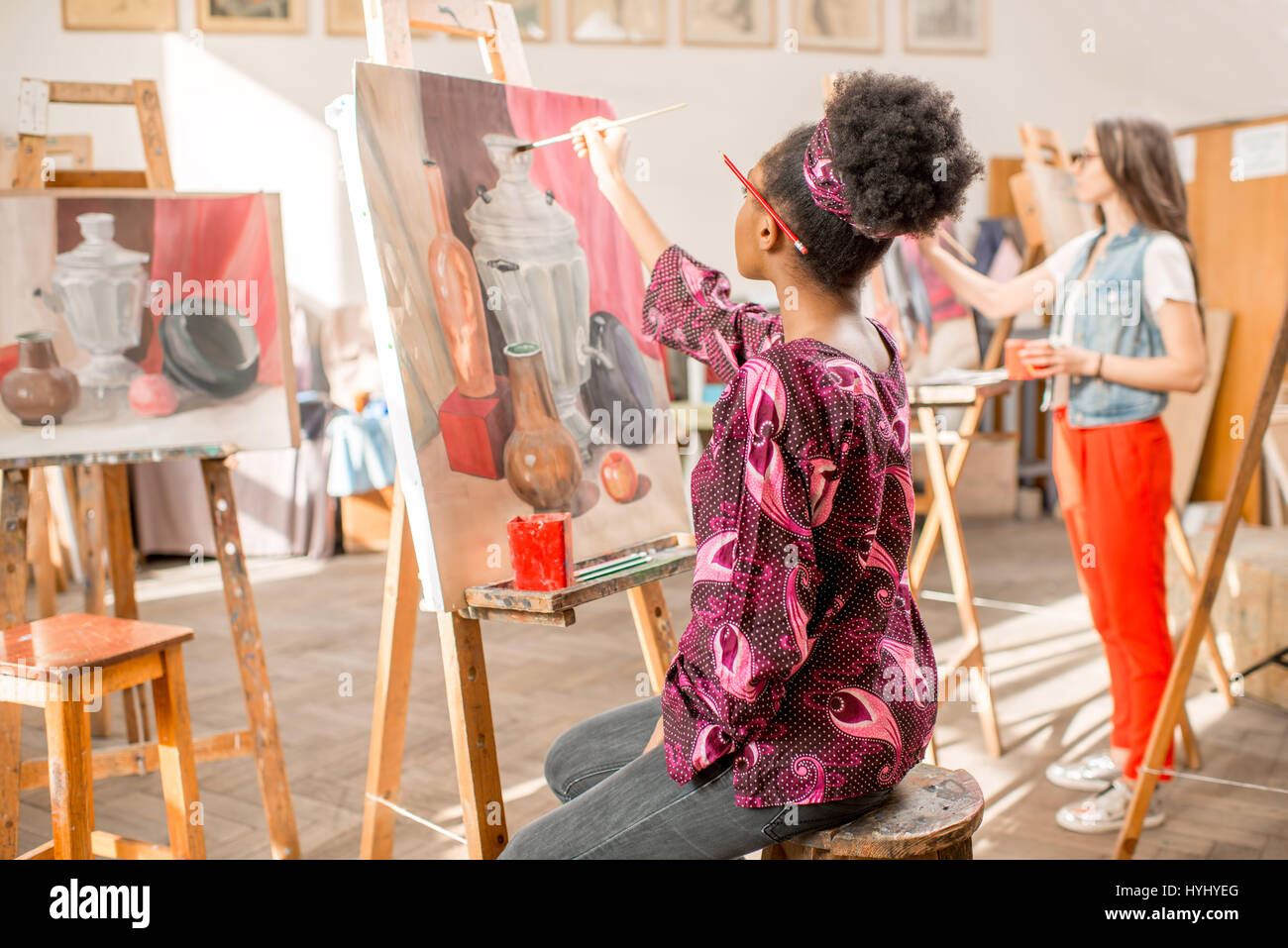Creative student at the painting studio Stock Photo - Alamy
