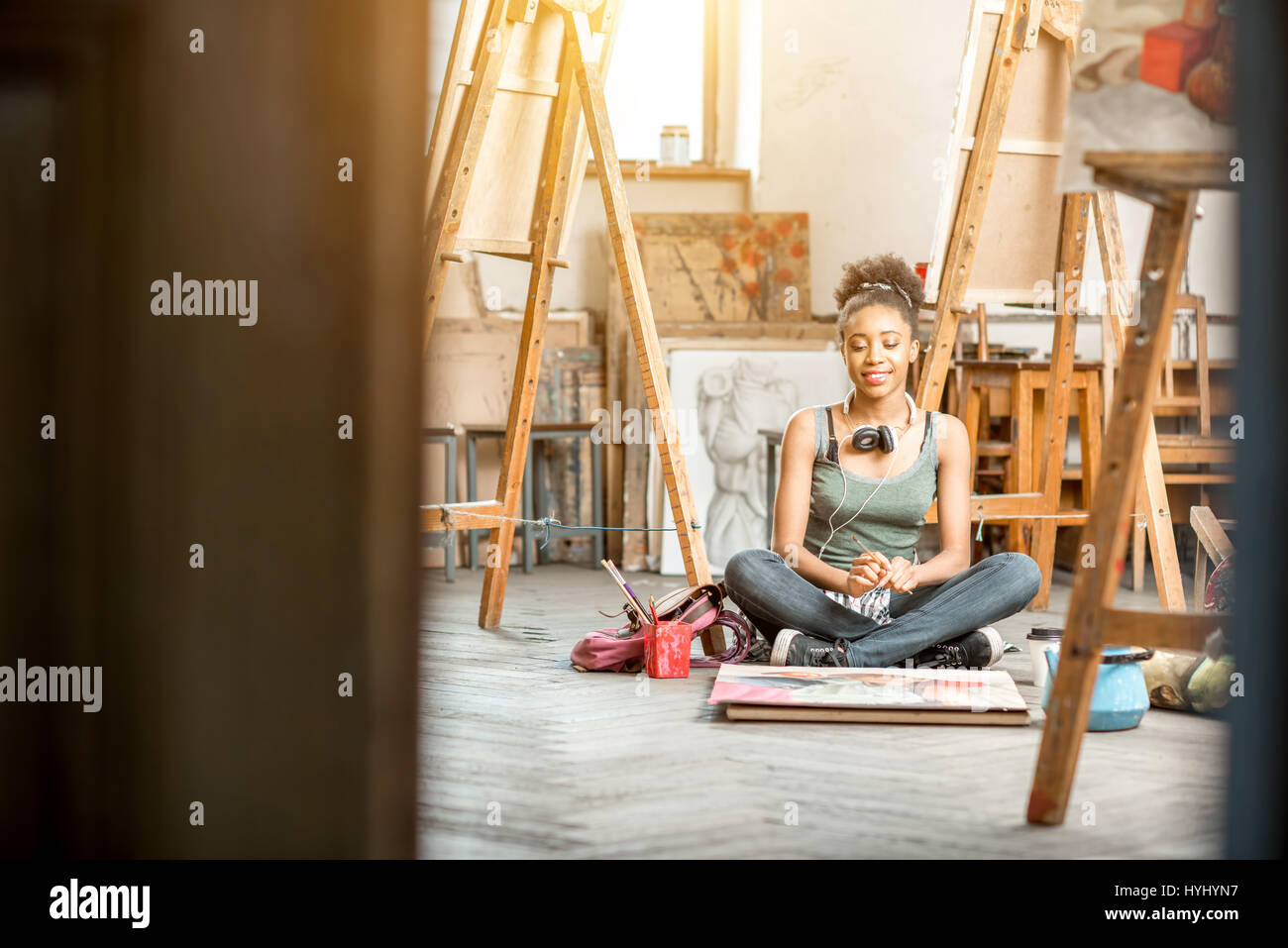 Creative student painting at the university Stock Photo - Alamy
