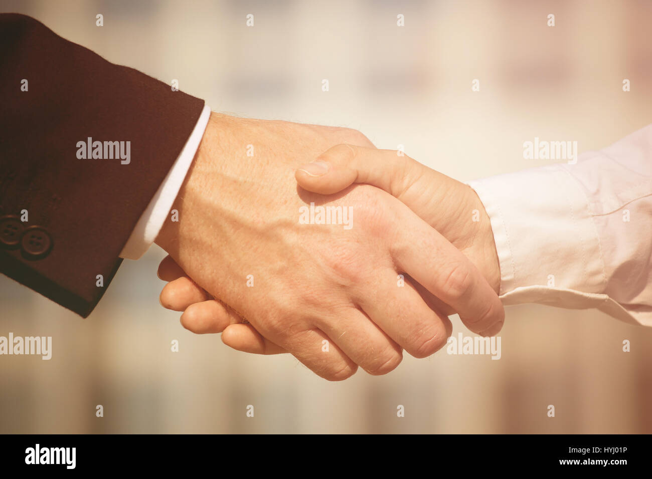 Hand shaking background Stock Photo - Alamy
