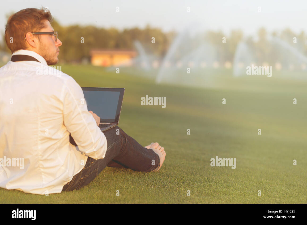 Freelancer in the park Stock Photo - Alamy