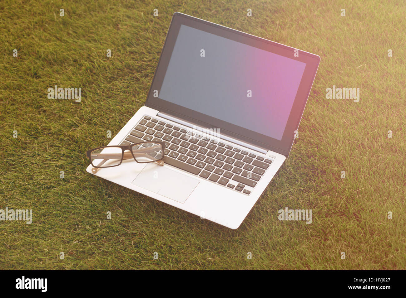 Laptop and glasses Stock Photo - Alamy