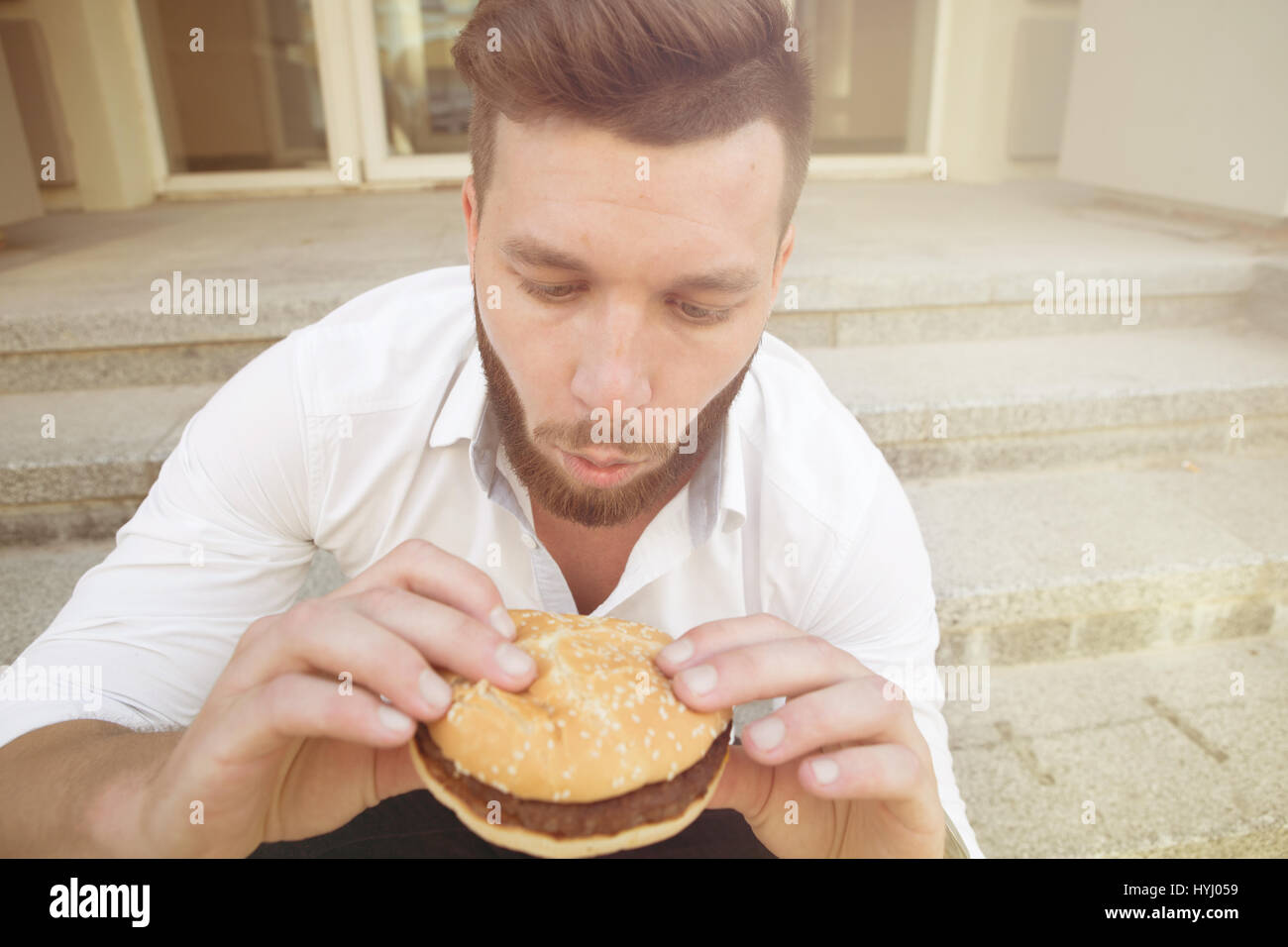 Man with hamburger Stock Photo - Alamy