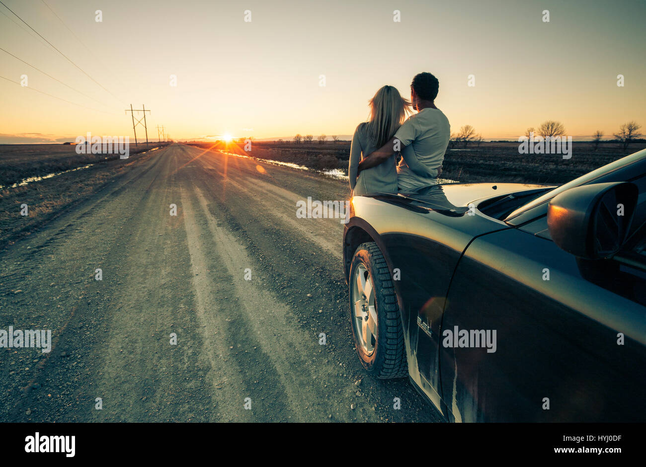 Two people watching the sunset hi-res stock photography and images - Alamy