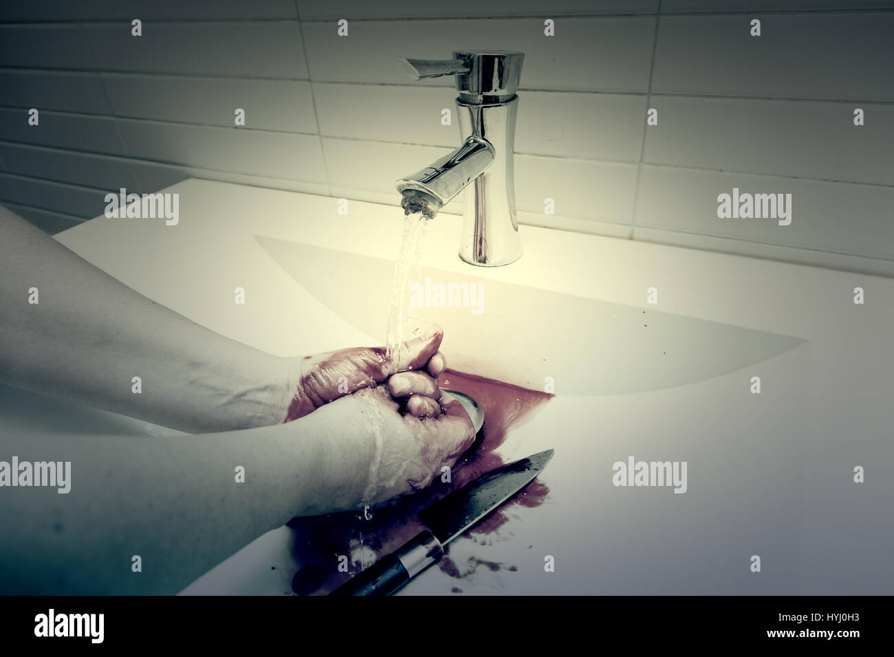 Assassin cleaning the blood, detail of a homicide, blood and death ...