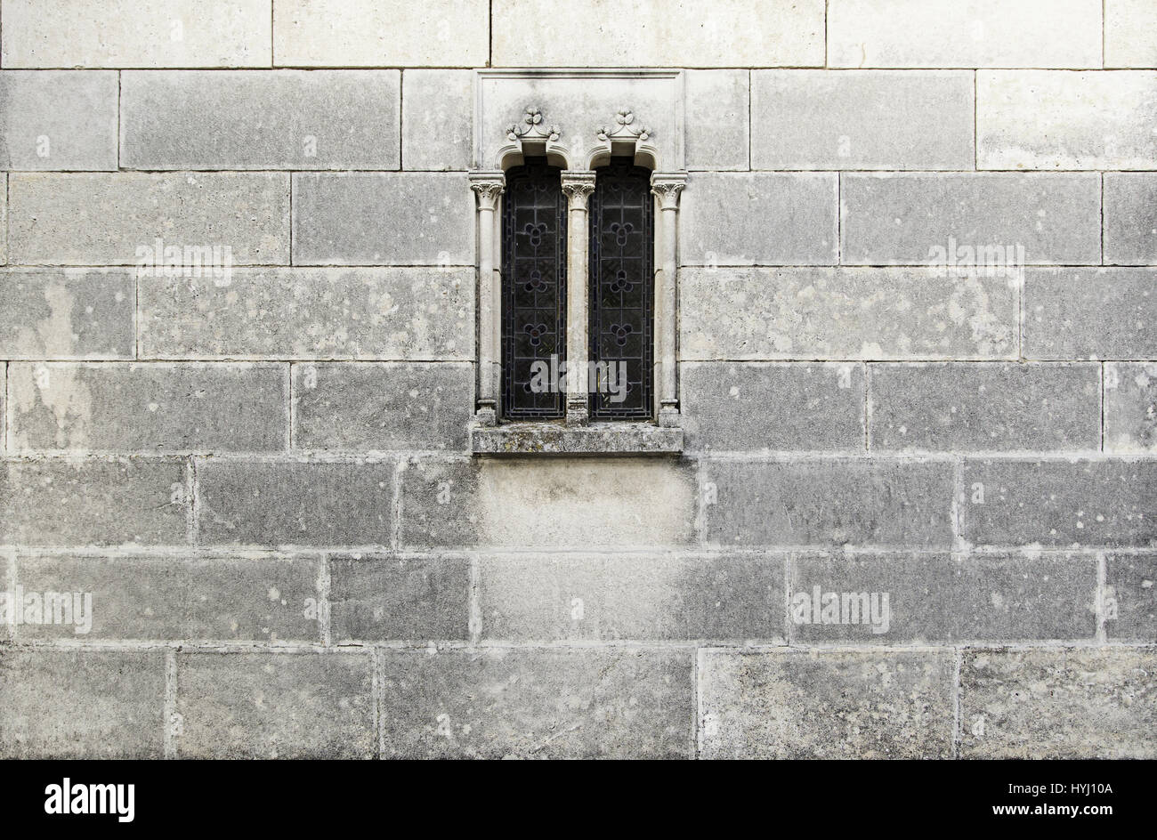 Medieval stone window, detail of a stone wall Stock Photo - Alamy