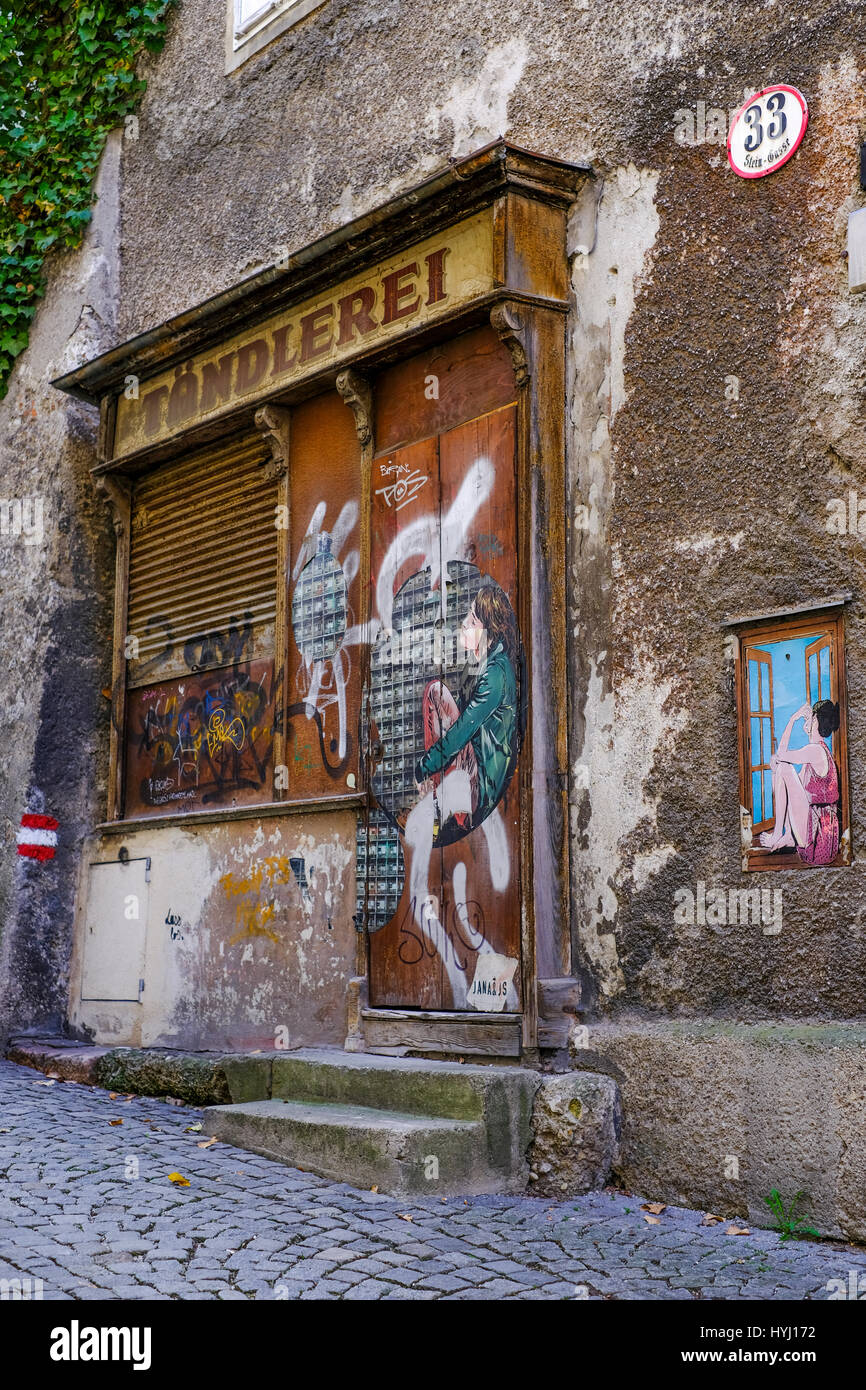 graffiti on shop front, Salzburg Stock Photo - Alamy