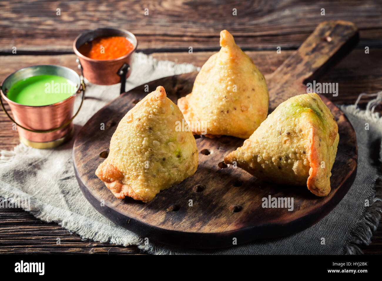 Indian samosa with vegetables and green dip Stock Photo - Alamy