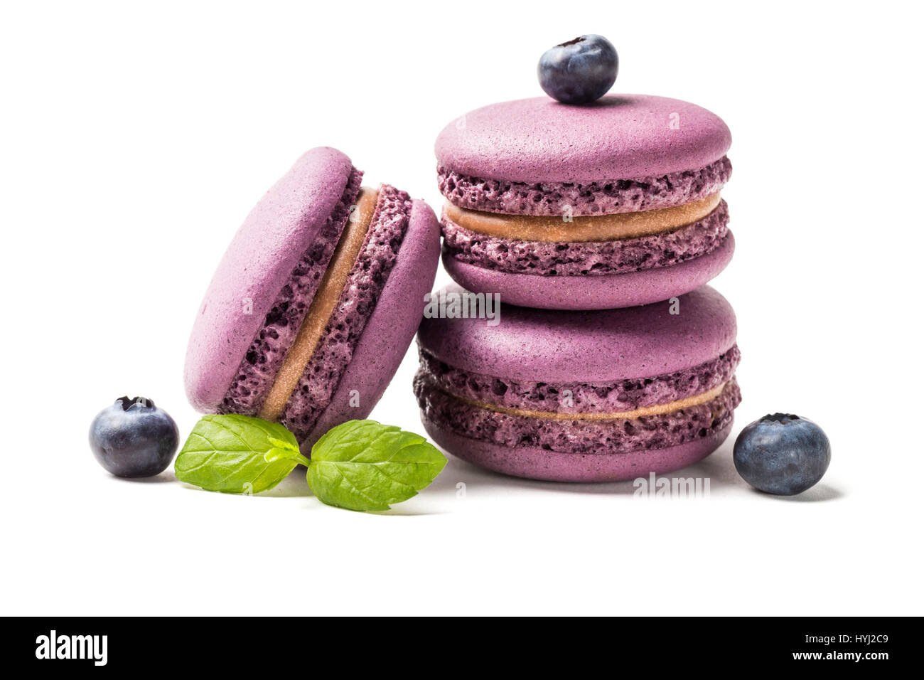 Closeup of small macaroons with blackberries on white background Stock ...