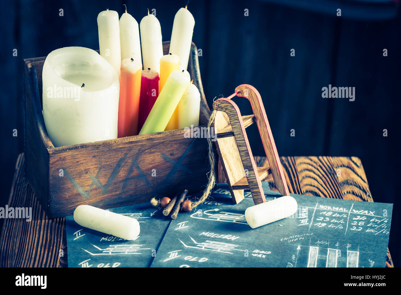 Homemade wooden sledge waxing for better speed Stock Photo - Alamy