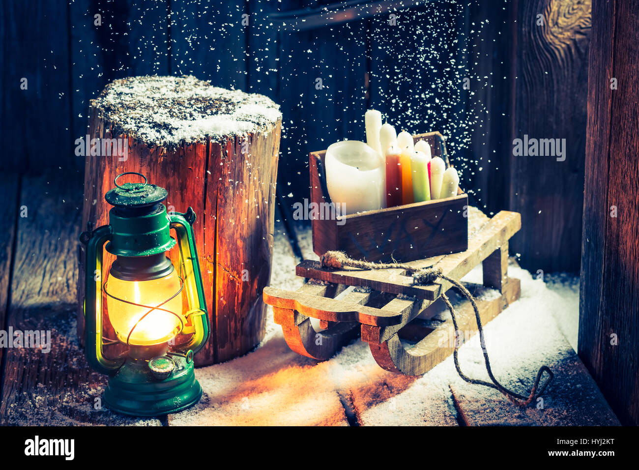 Snowy winter hut with small wooden sleigh Stock Photo - Alamy