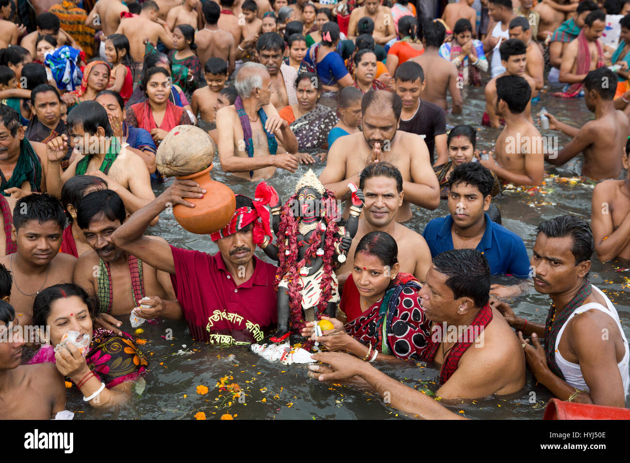 Hindu devotees take holy dip hi-res stock photography and images - Alamy