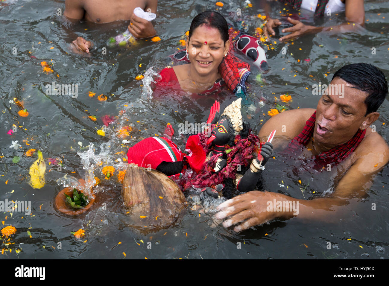 Narayangan, Bangladesh. 4th Apr, 2017. Hindu devotees take a holy dip ...