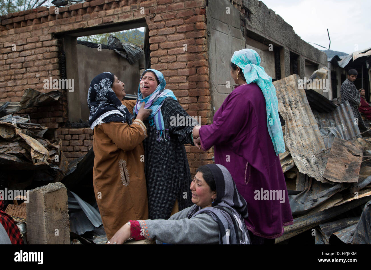 Srinagar, Indian-controlled Kashmir. 5th Apr, 2017. People wail outside ...