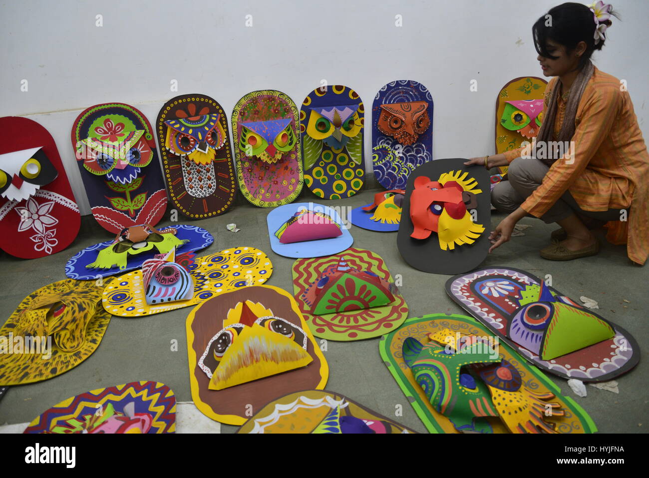 Student of Faculty of Fine arts of Dhaka University painting masks for ...
