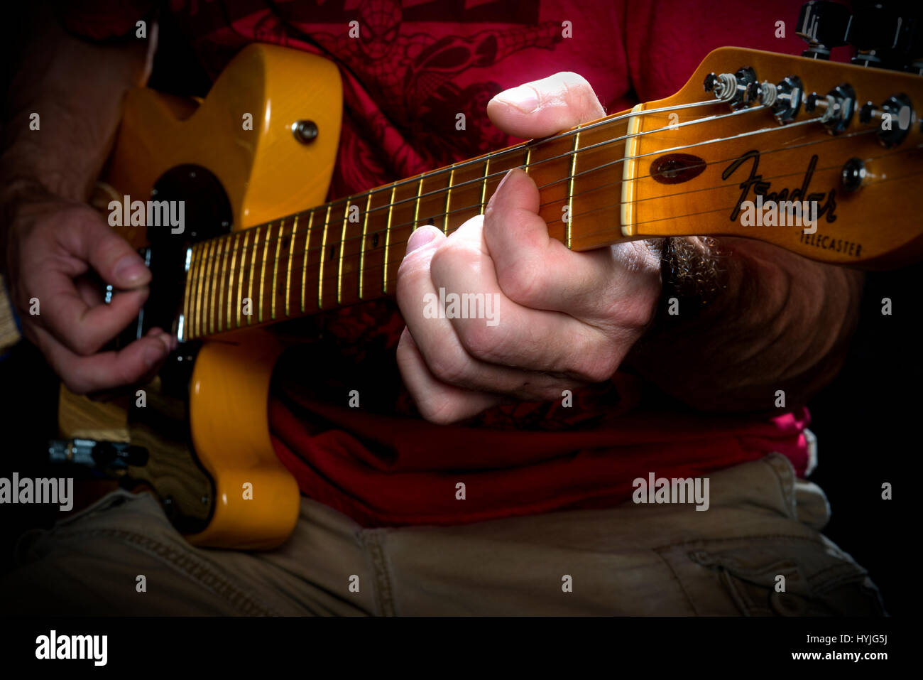 Person playing string instrument hi-res stock photography and images ...