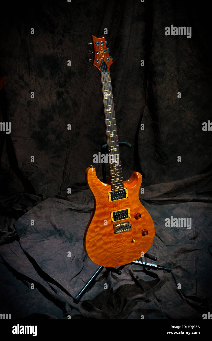six string electric guitar on stand Stock Photo - Alamy