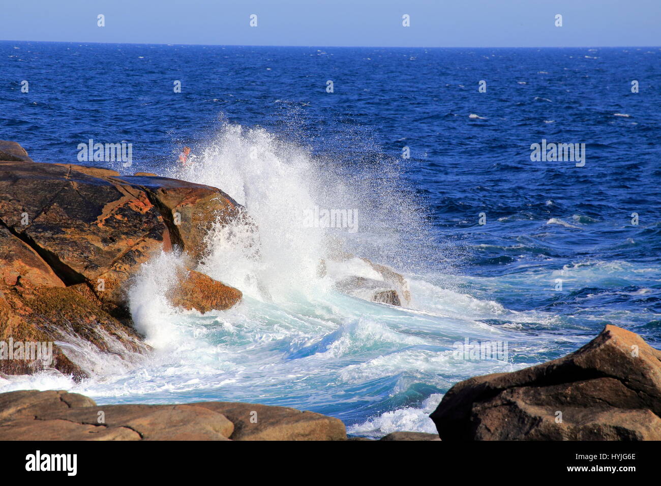 A man about to be swept off the rocks at Peggy's Cove, Nova Scotia ...