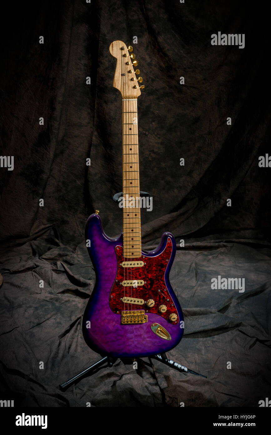 six string electric guitar on stand Stock Photo - Alamy