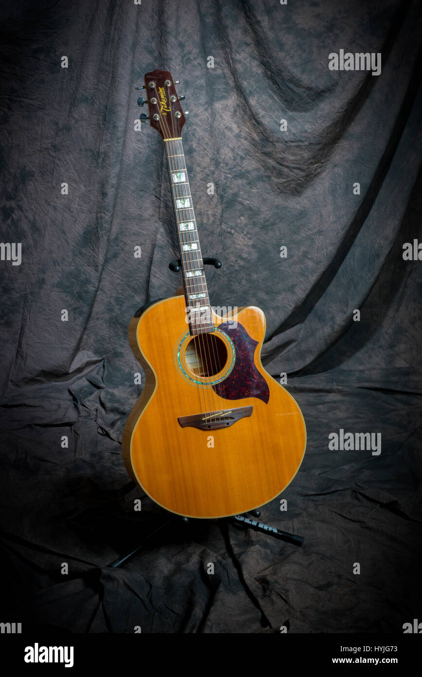 six string acoustic guitar on stand Stock Photo - Alamy