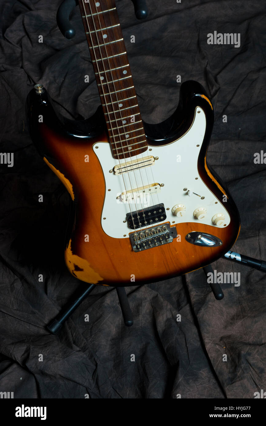 six string electric guitar on stand Stock Photo - Alamy