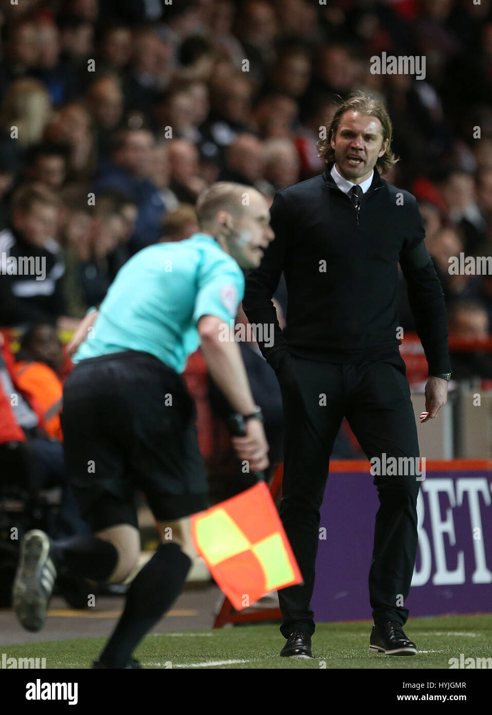MK Dons manager Robbie Neilson gestures on the touchline to the ...