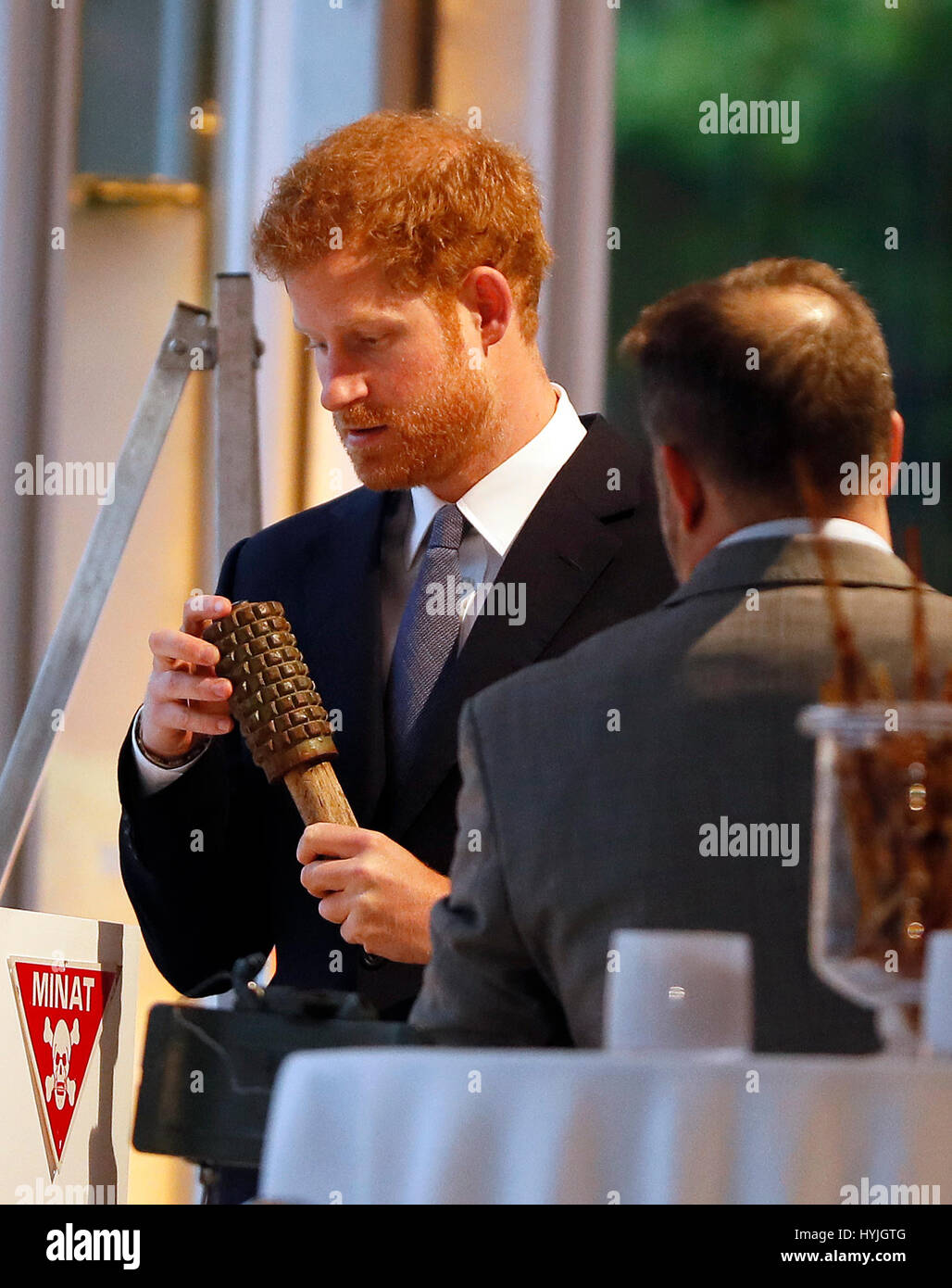 Prince Harry holds an Anti-Personnel Fragmentation Mine during the ...