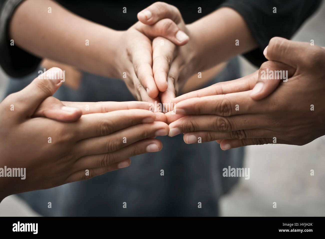 Team work : Three human hands join together Stock Photo - Alamy