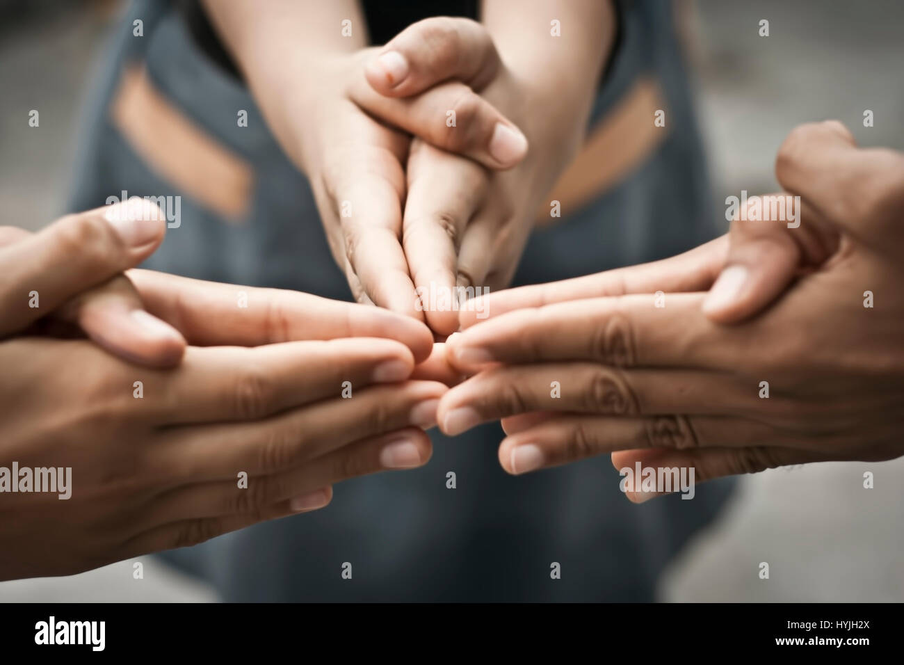 Team work : Three human hands join together Stock Photo - Alamy