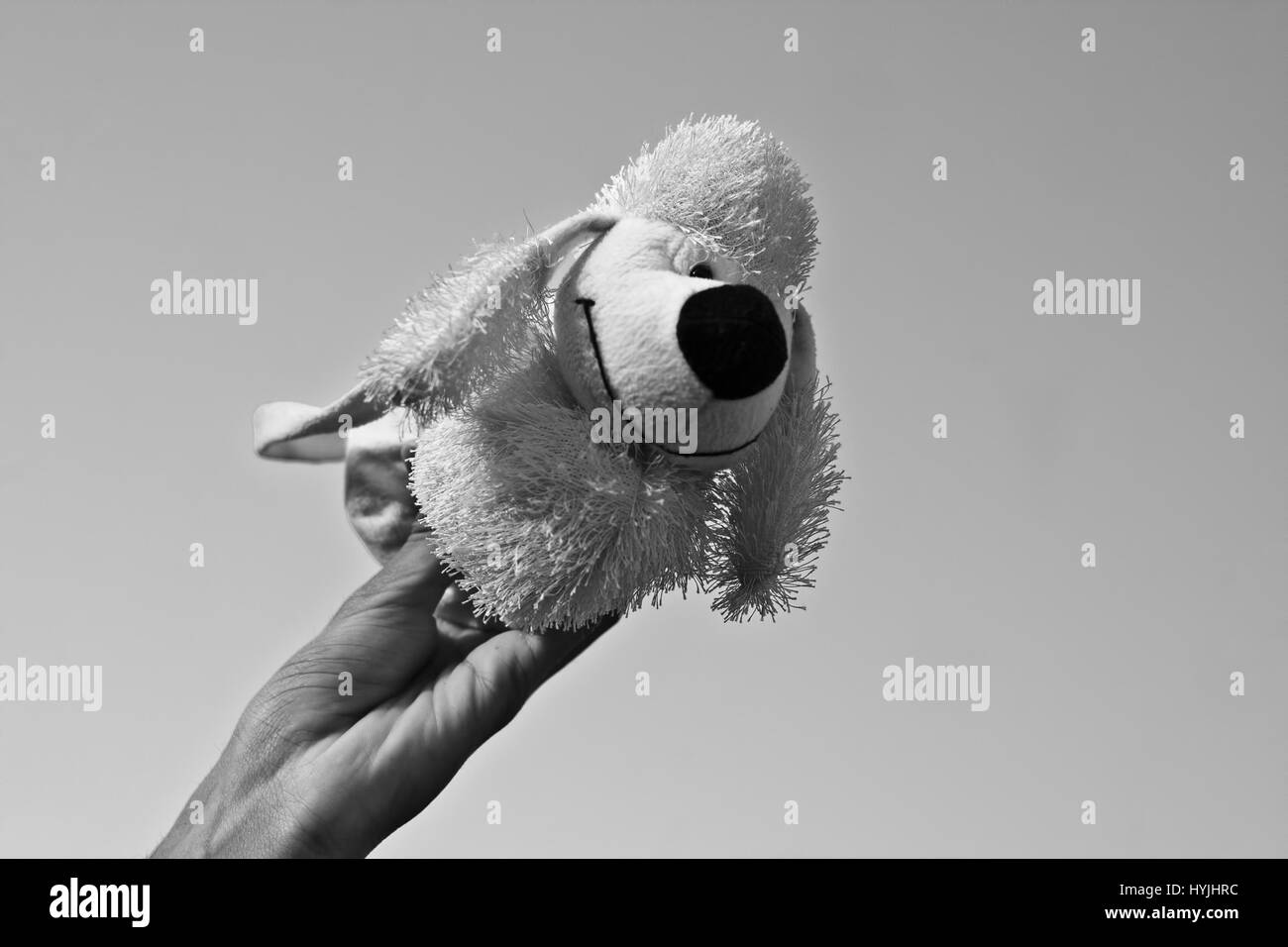 A hand showing his little stuff toy Stock Photo - Alamy