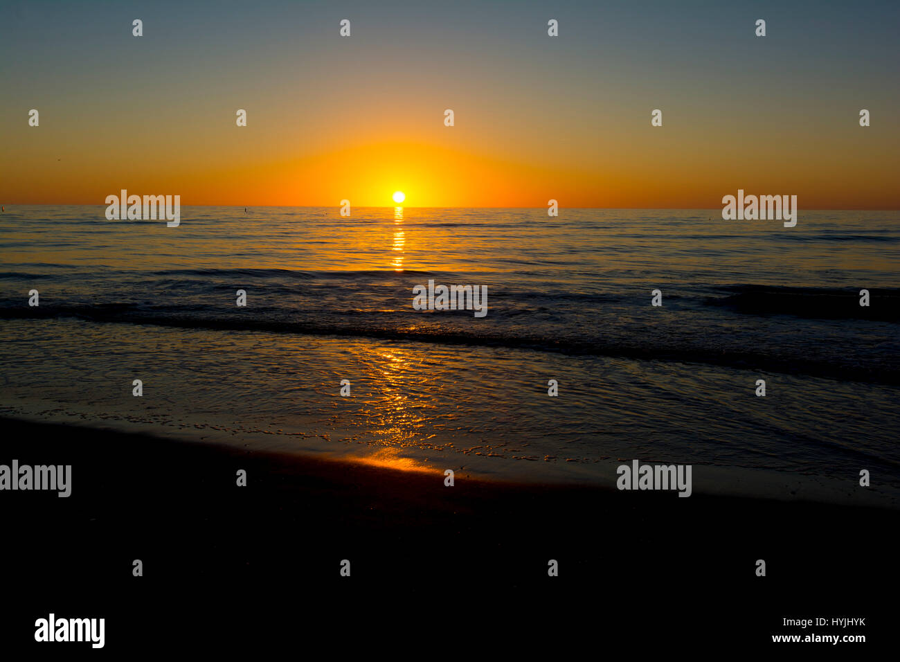 sunset over ocean Stock Photo - Alamy