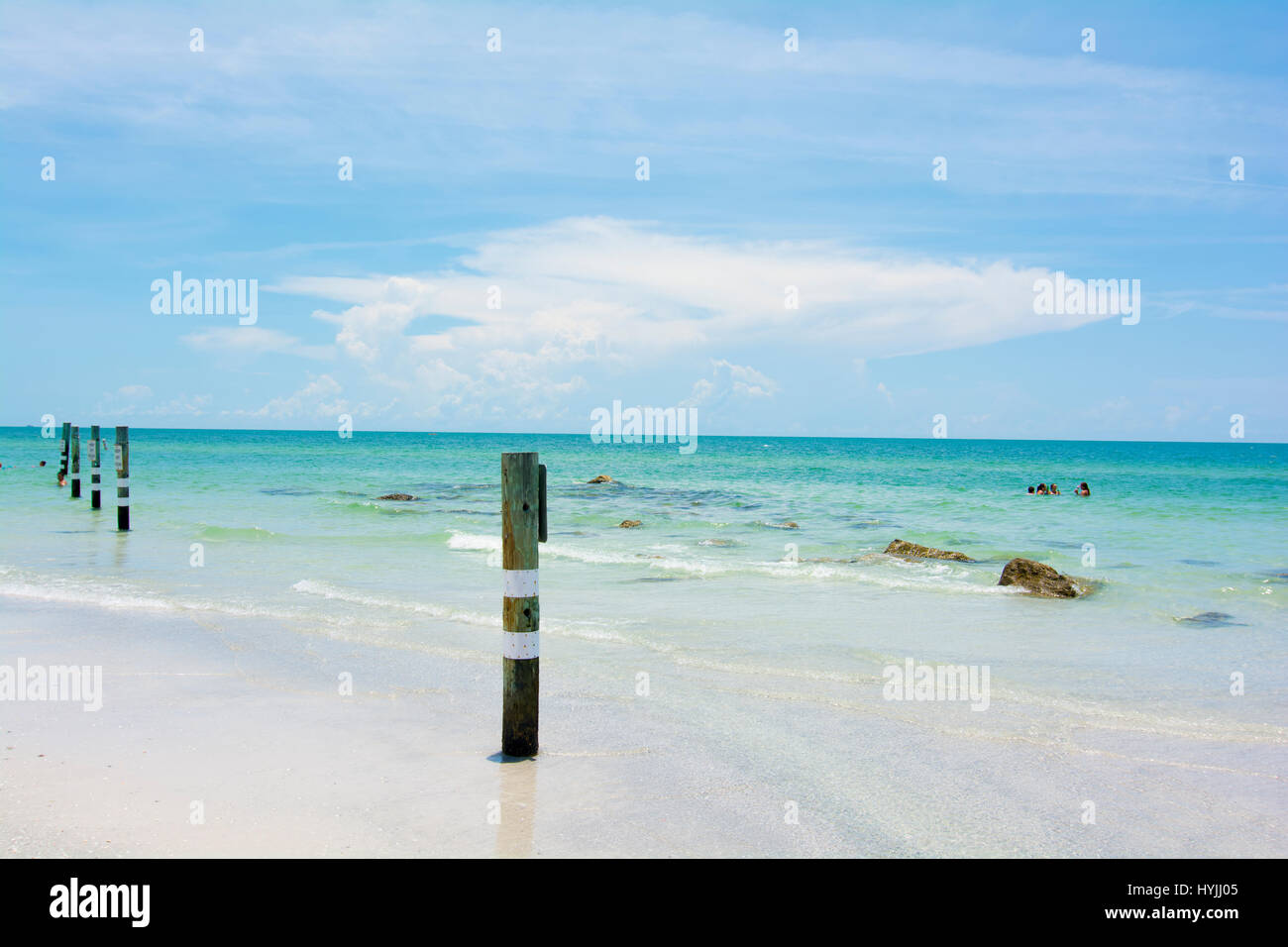 old pilings in ocean at beach Stock Photo - Alamy