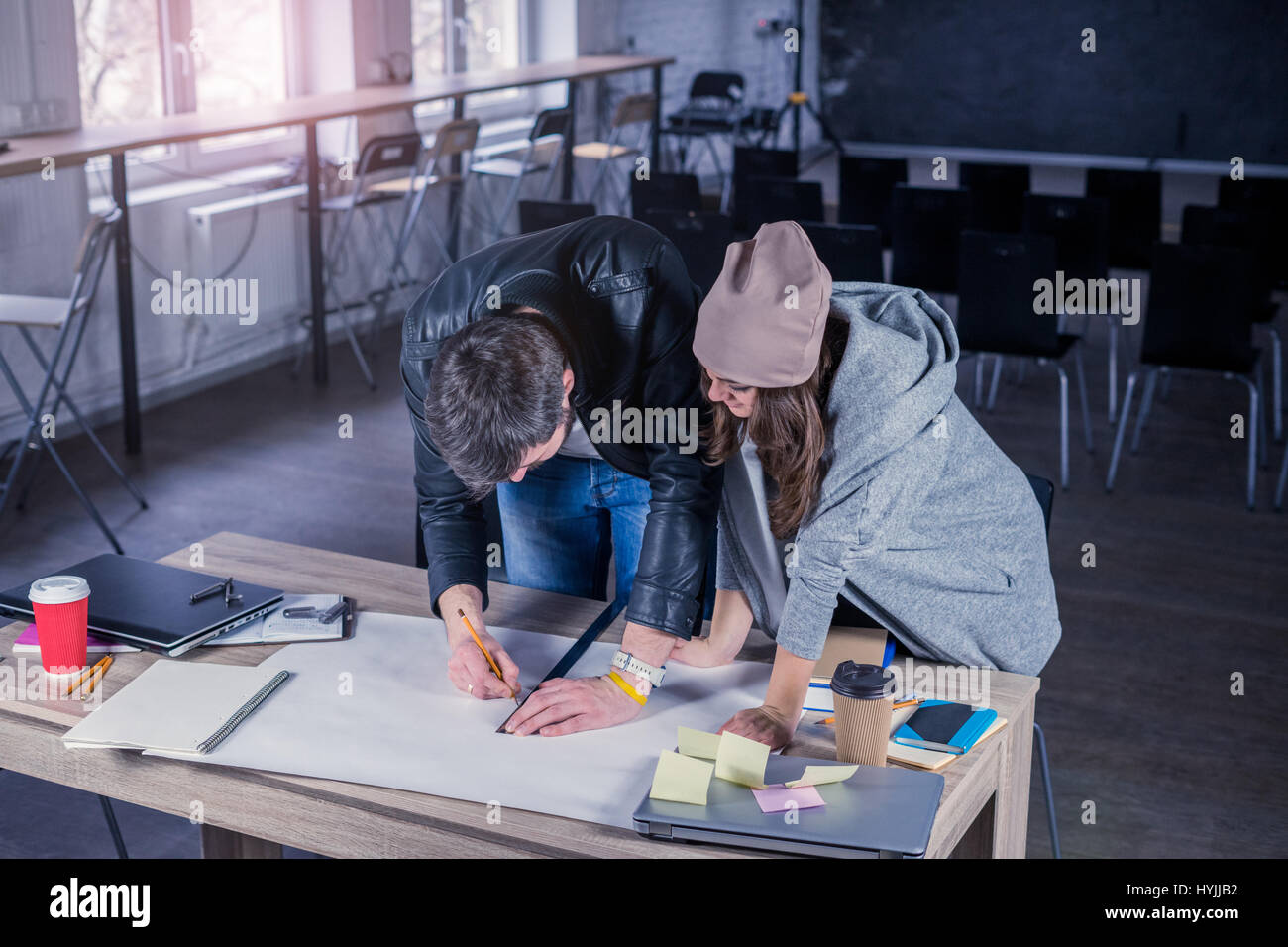 Team of architects people drawing construction project on desk ...