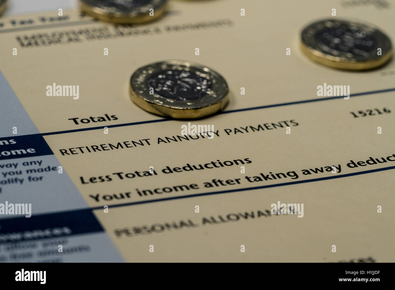 Income tax return and pounds coins Stock Photo - Alamy