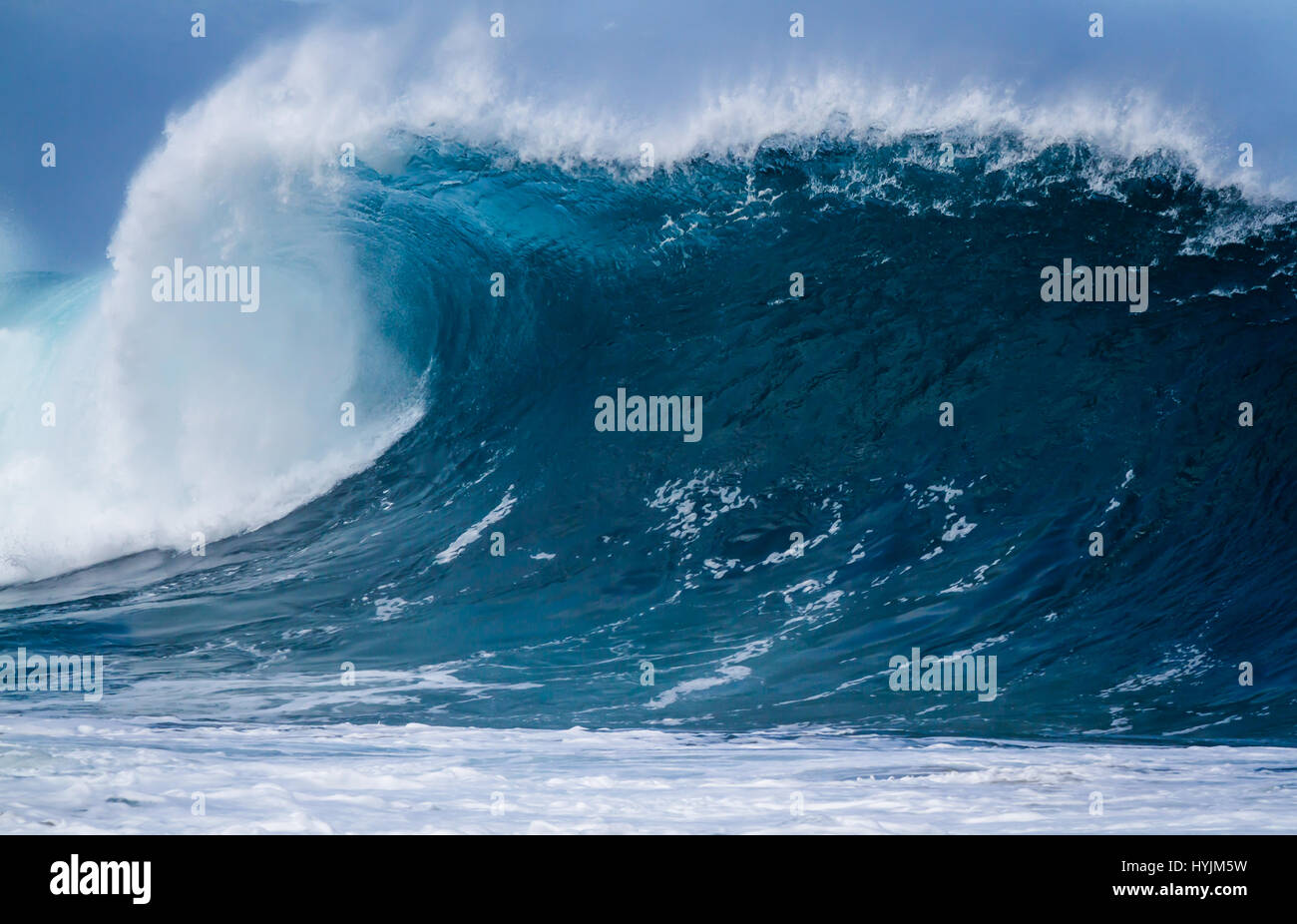 Big breaking shore break Ocean wave on the beach of the north shore of ...