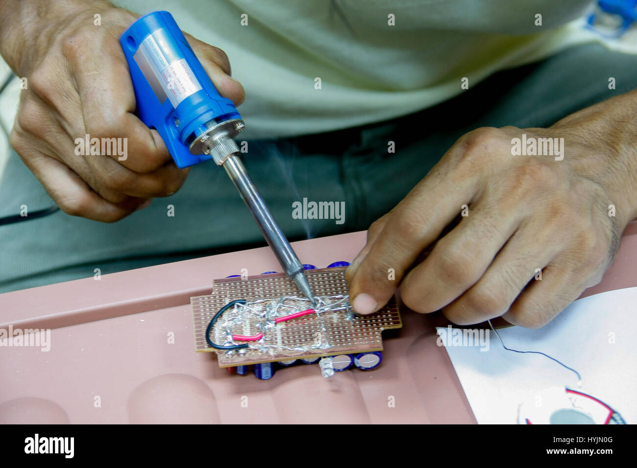 Electronics technician assembly electronic panel Stock Photo - Alamy