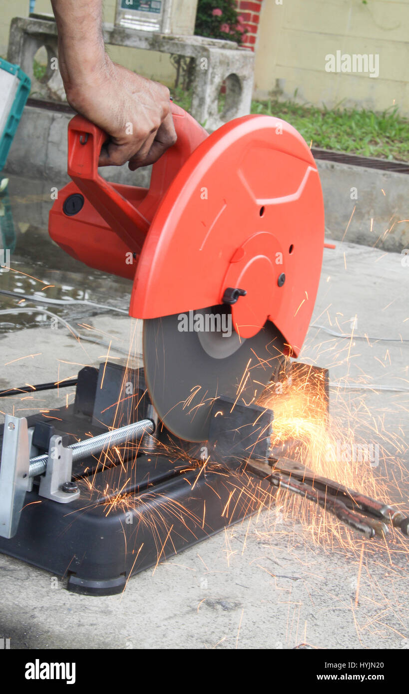 cutting steel with grinder machine close up Stock Photo - Alamy