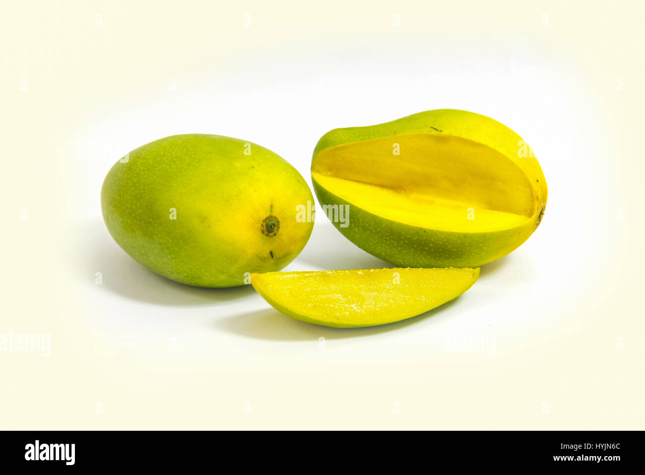 beautiful and appetizing of green-yellow mangoes on white background ...