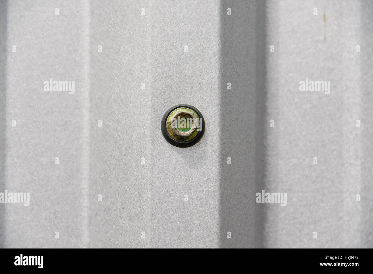 gray nut with metal sheet for wall or tile Stock Photo - Alamy