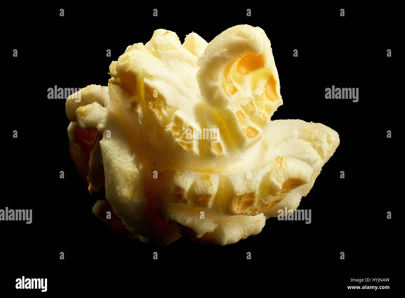 Popped popcorn isolated on a black background Stock Photo - Alamy