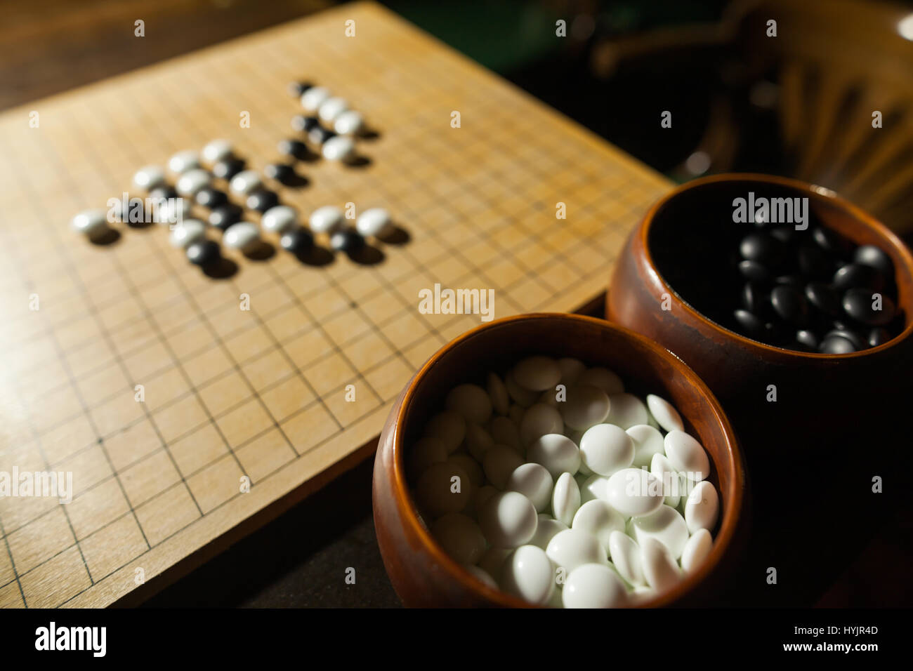 Close up shot of a Go board game, with black and white stones Stock ...