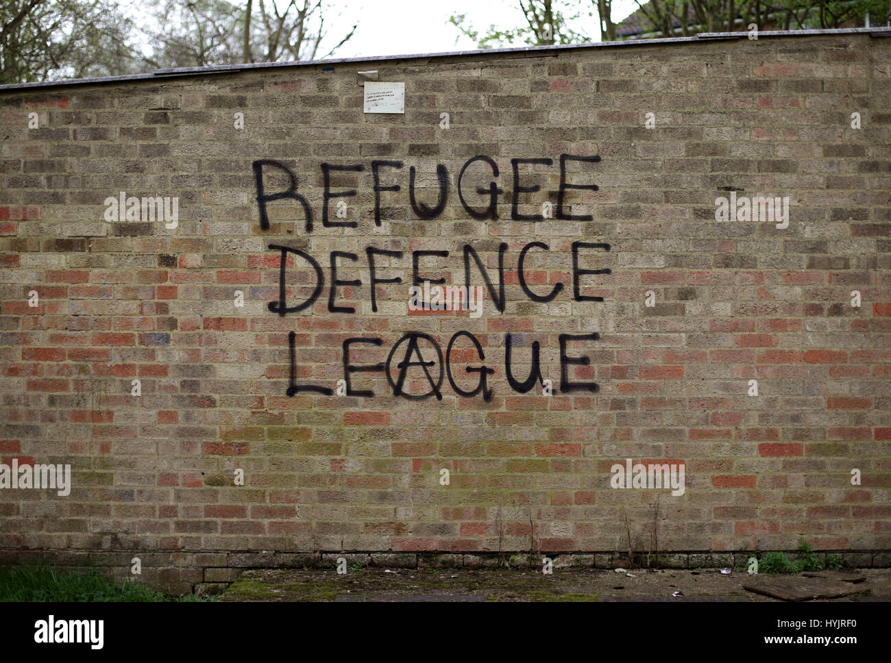 'Refugee Defence League' graffiti is seen near the site of the assault ...
