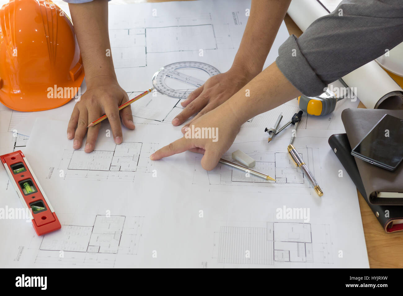 Architect working on blueprint. Architects workplace - architectural ...