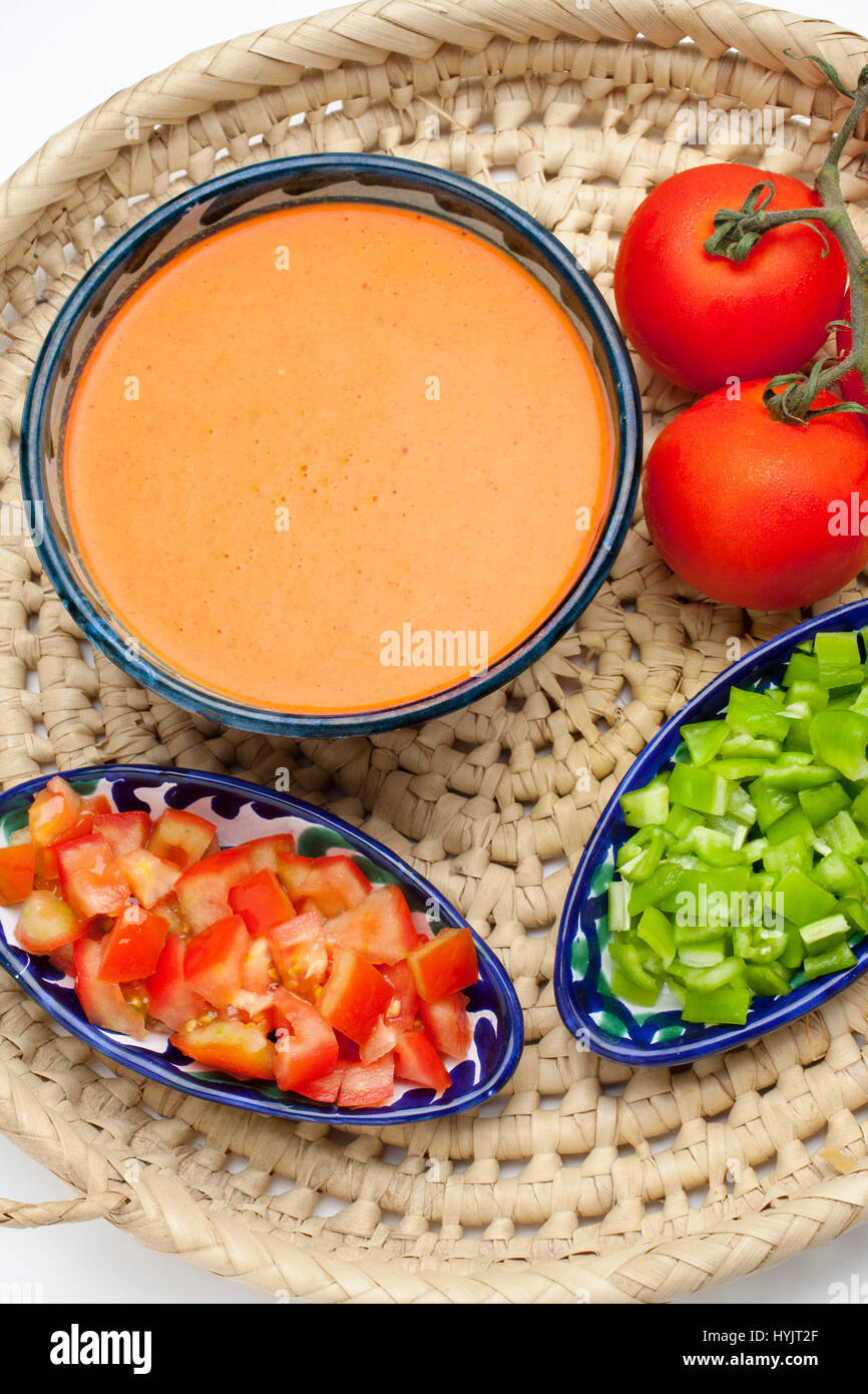 Food. Traditional Andalusian gazpacho with its ingredients. Tomato and ...